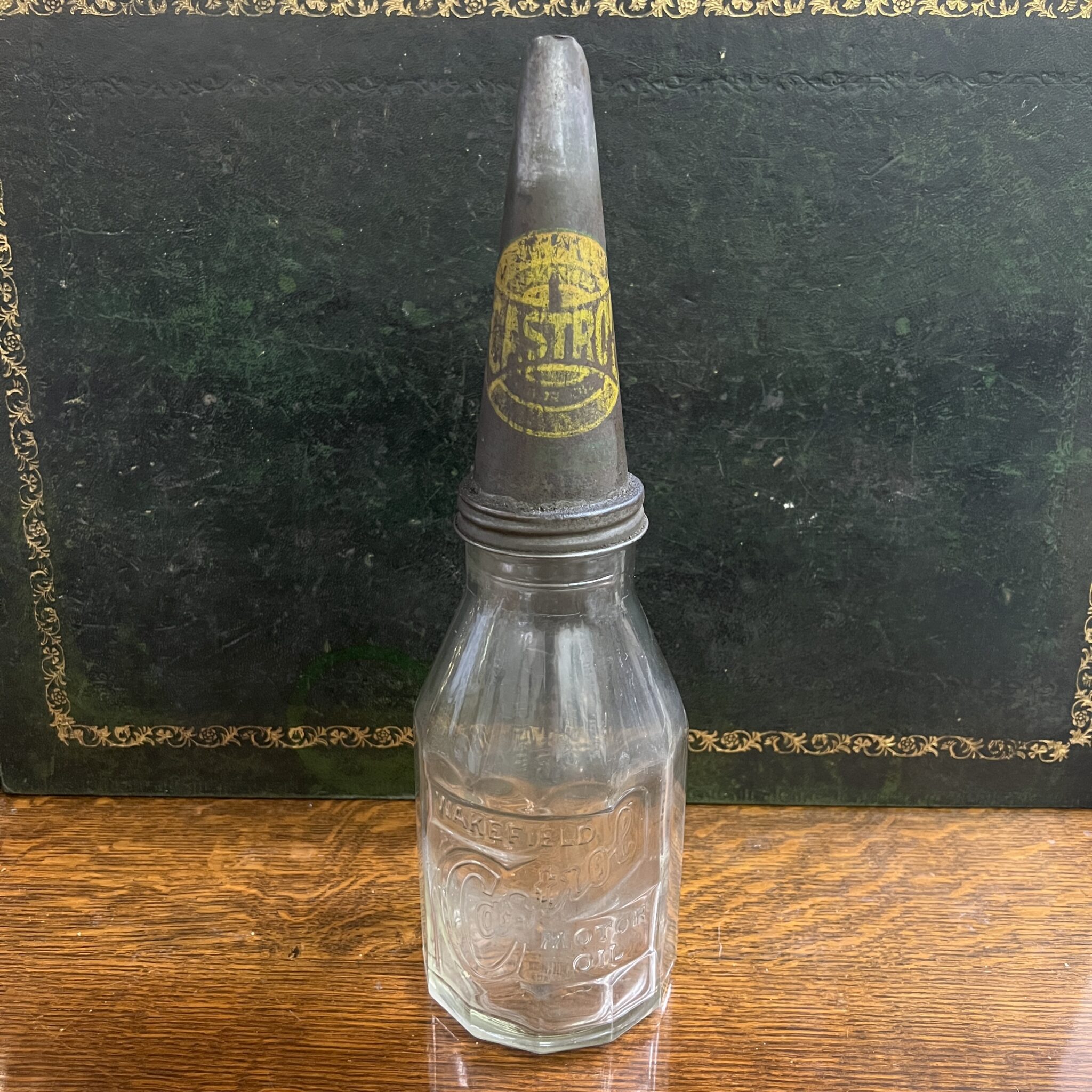 An Early Castrol oil Wakefield glass oil bottle with steel spout ...